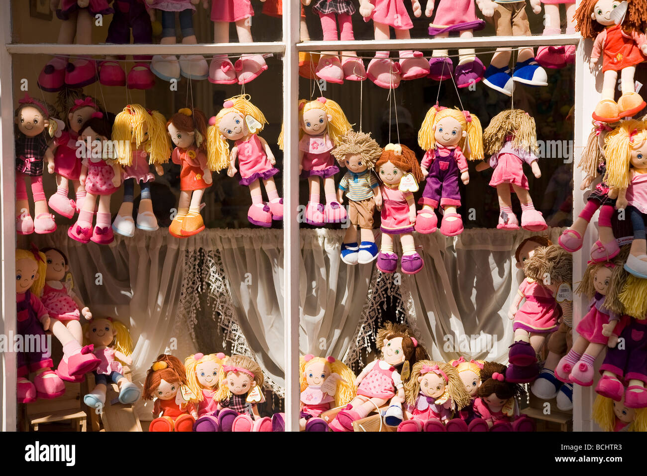 dolls in shop window Stock Photo - Alamy