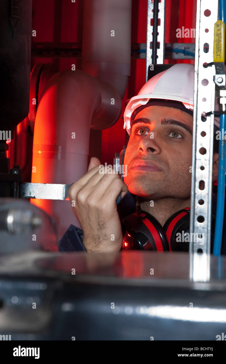 Engineer working on plant room industrial boilers Stock Photo - Alamy