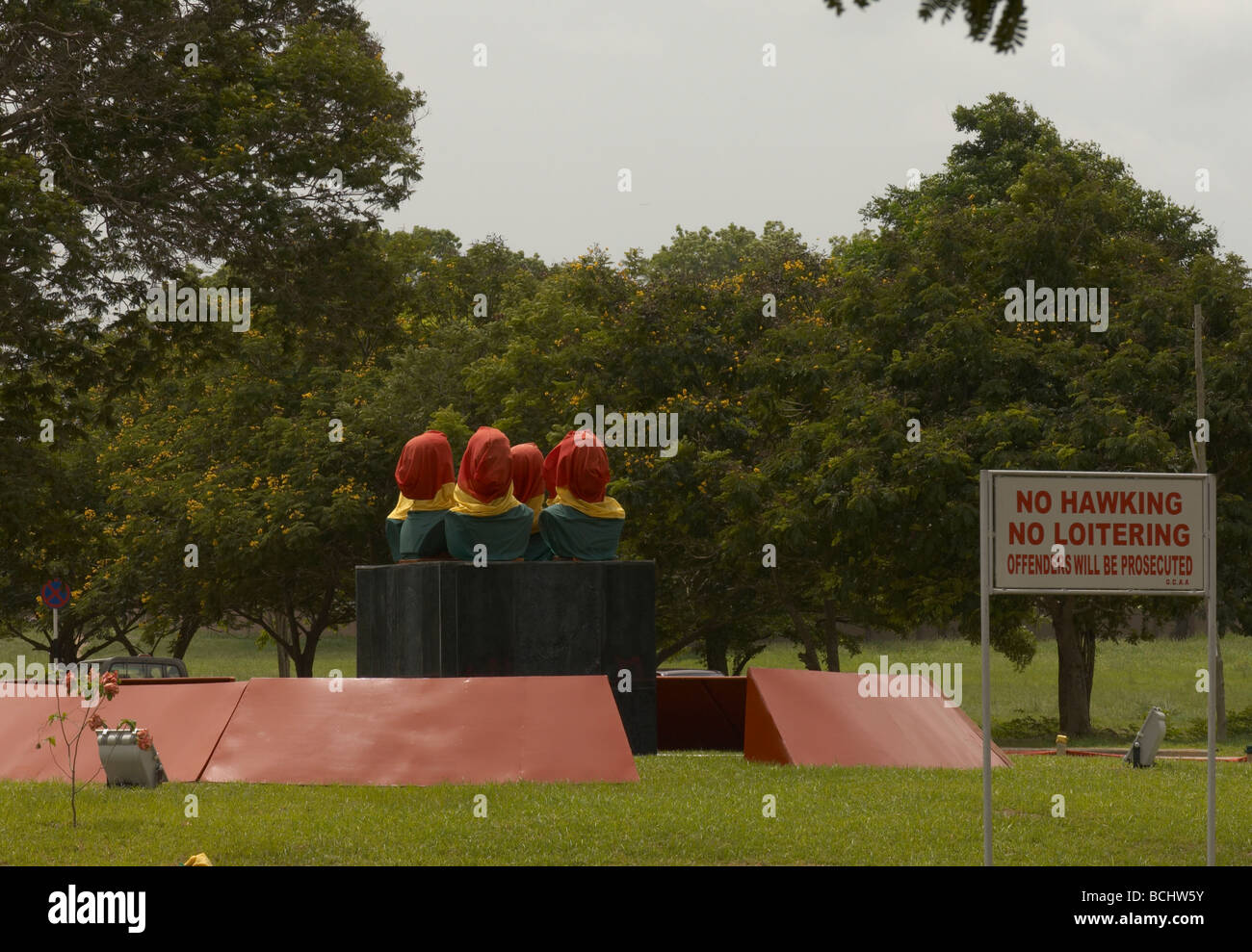 Statues covered with flags at roundabout in Accra Ghana Stock Photo - Alamy