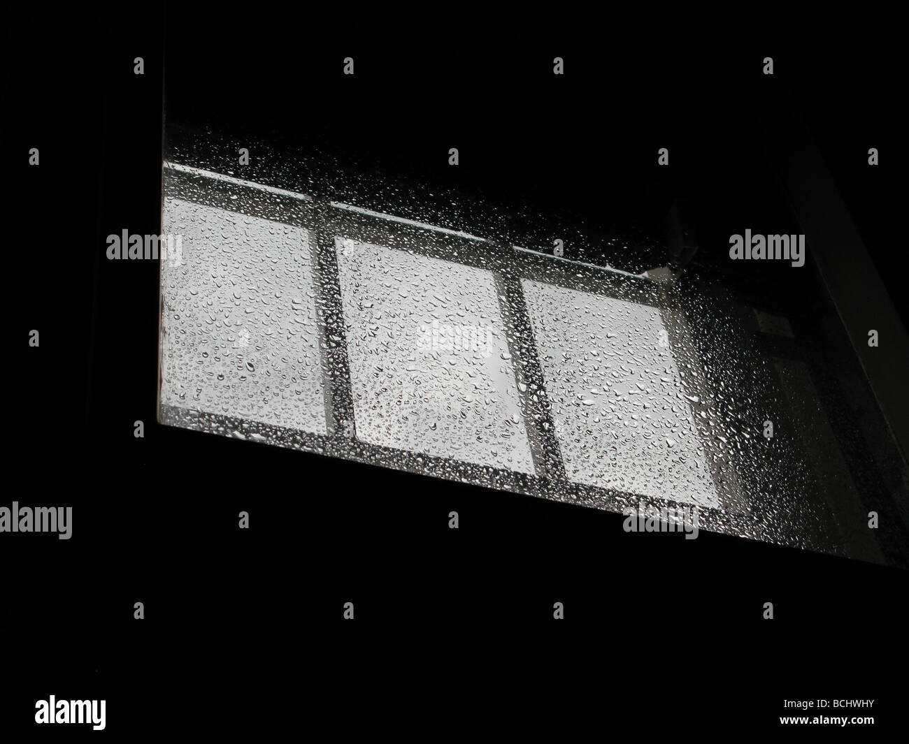rain drops covered window seen from inside dark room Stock Photo - Alamy