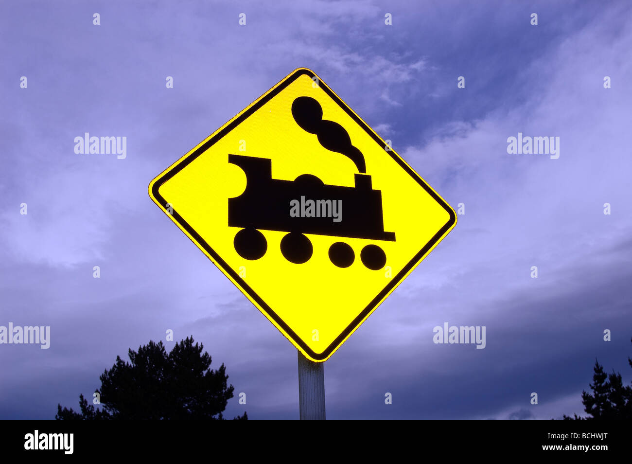 Road sign showing Railway Crossing ahead, New Zealand Stock Photo - Alamy