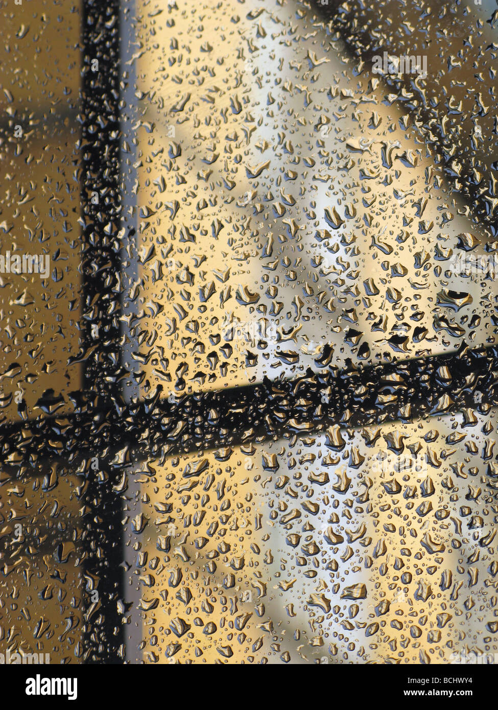 modern buildings seen through rain drops covered window Stock Photo - Alamy