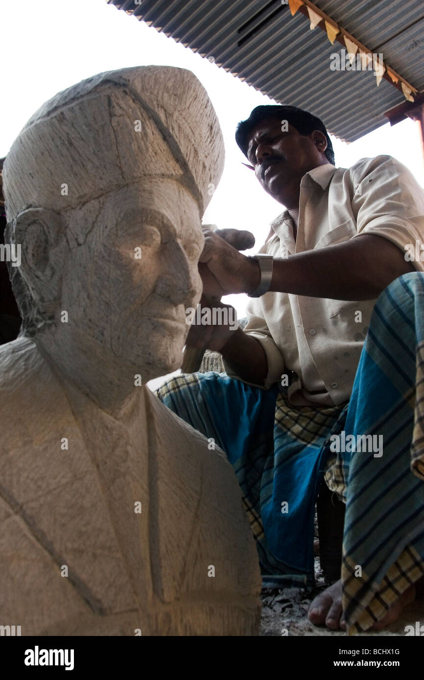 A mason (stone carver) works on a statue in Mysore, India. Stone ...
