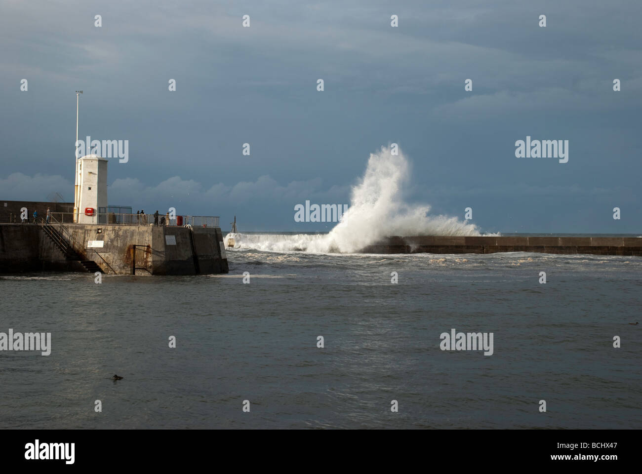 Lighthouse breaking waves hi-res stock photography and images - Alamy