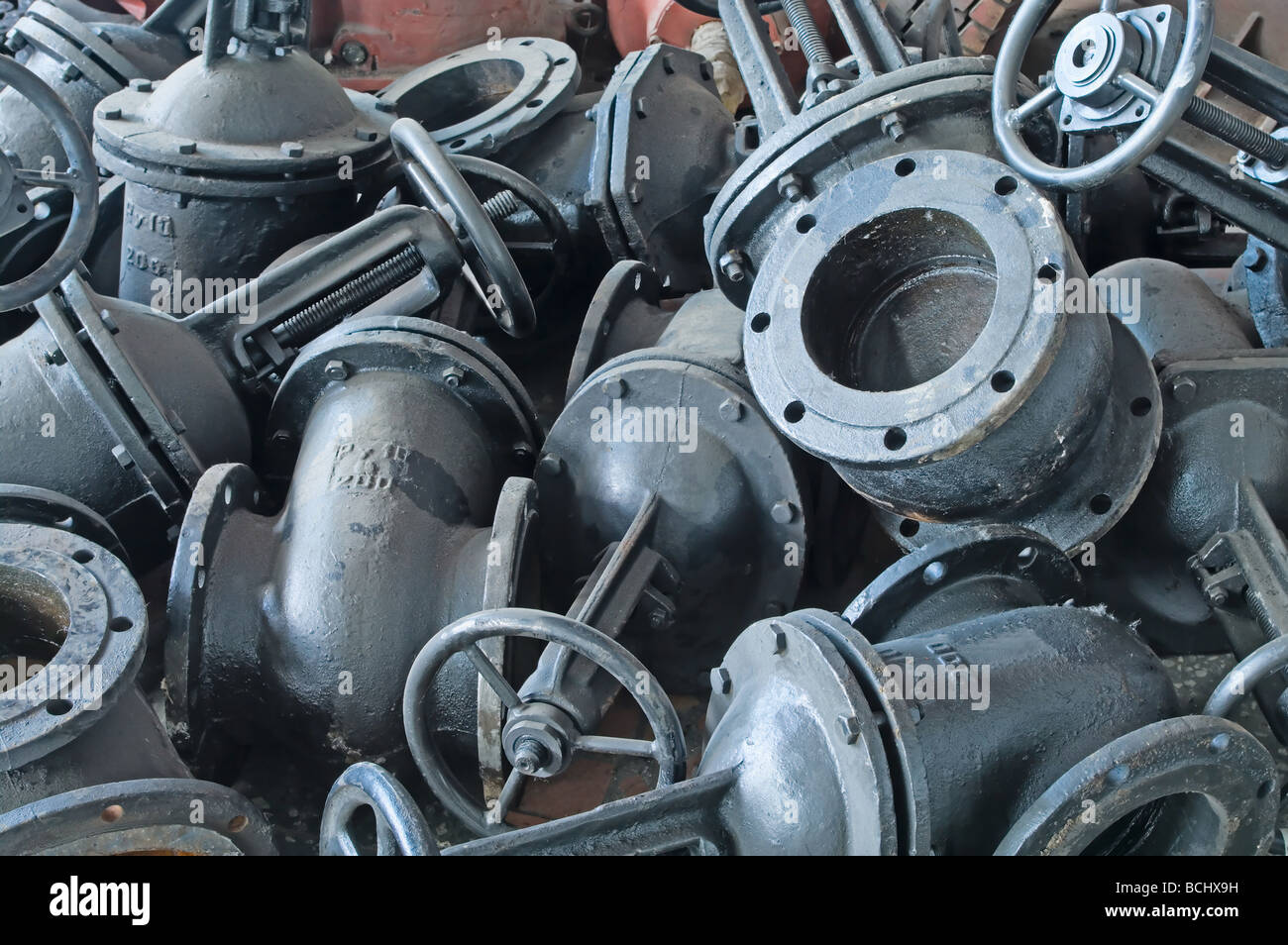 Heap of water shut-off valves big diameter. Background Stock Photo - Alamy