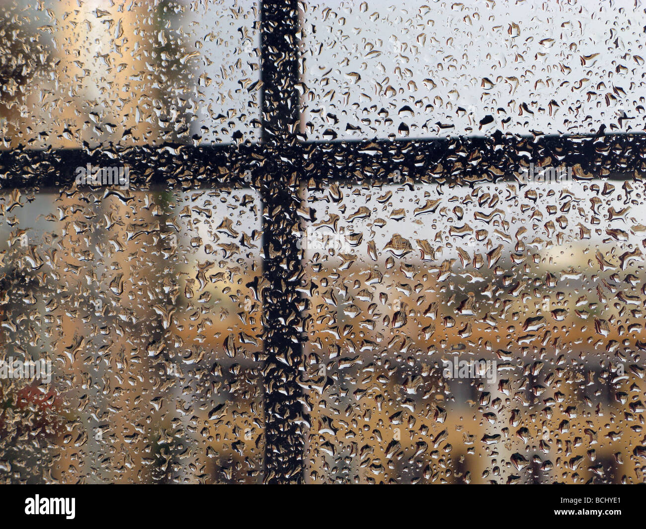 modern buildings seen through rain drops covered window Stock Photo - Alamy