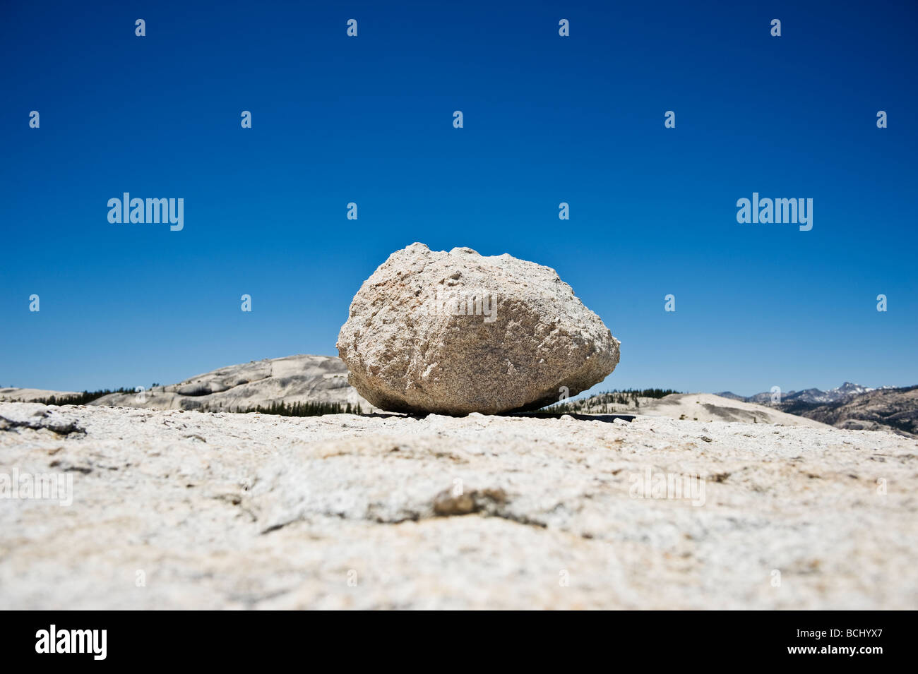 Lone granite boulder sits on top Pothole Dome, Tuolumne Meadows ...