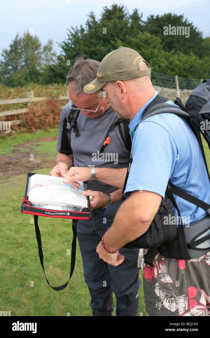 Two Adult Male Walkers checking an OS Map Buttermere Honnister Pass ...