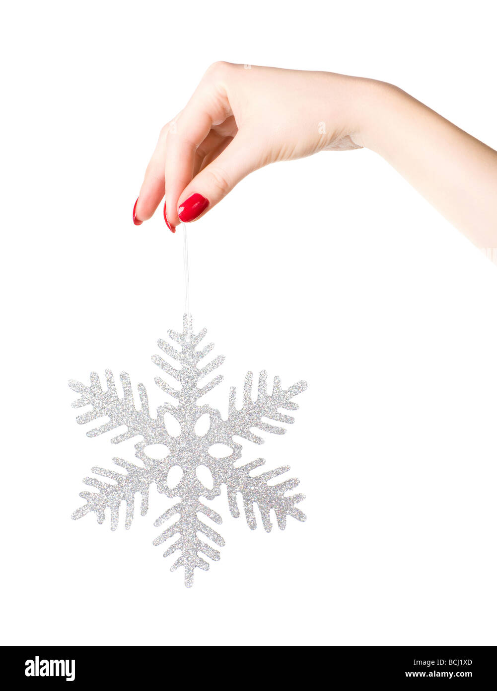Woman hand holding big holiday snowflake Isolated on white Stock Photo ...