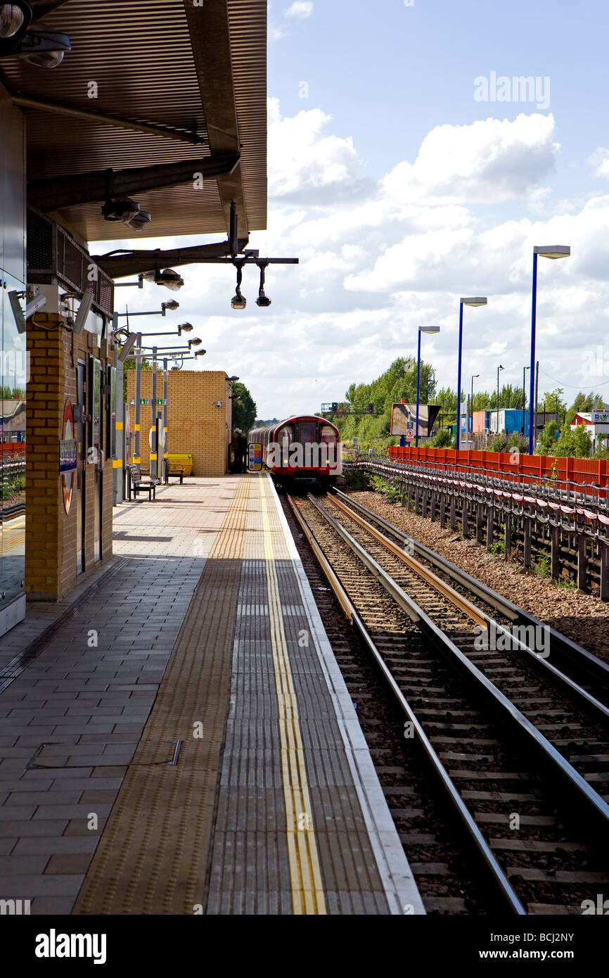 Tube train coming into station Stock Photo - Alamy