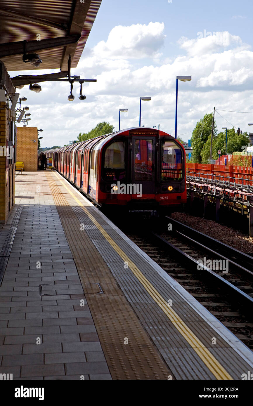 Tube train coming into station Stock Photo - Alamy