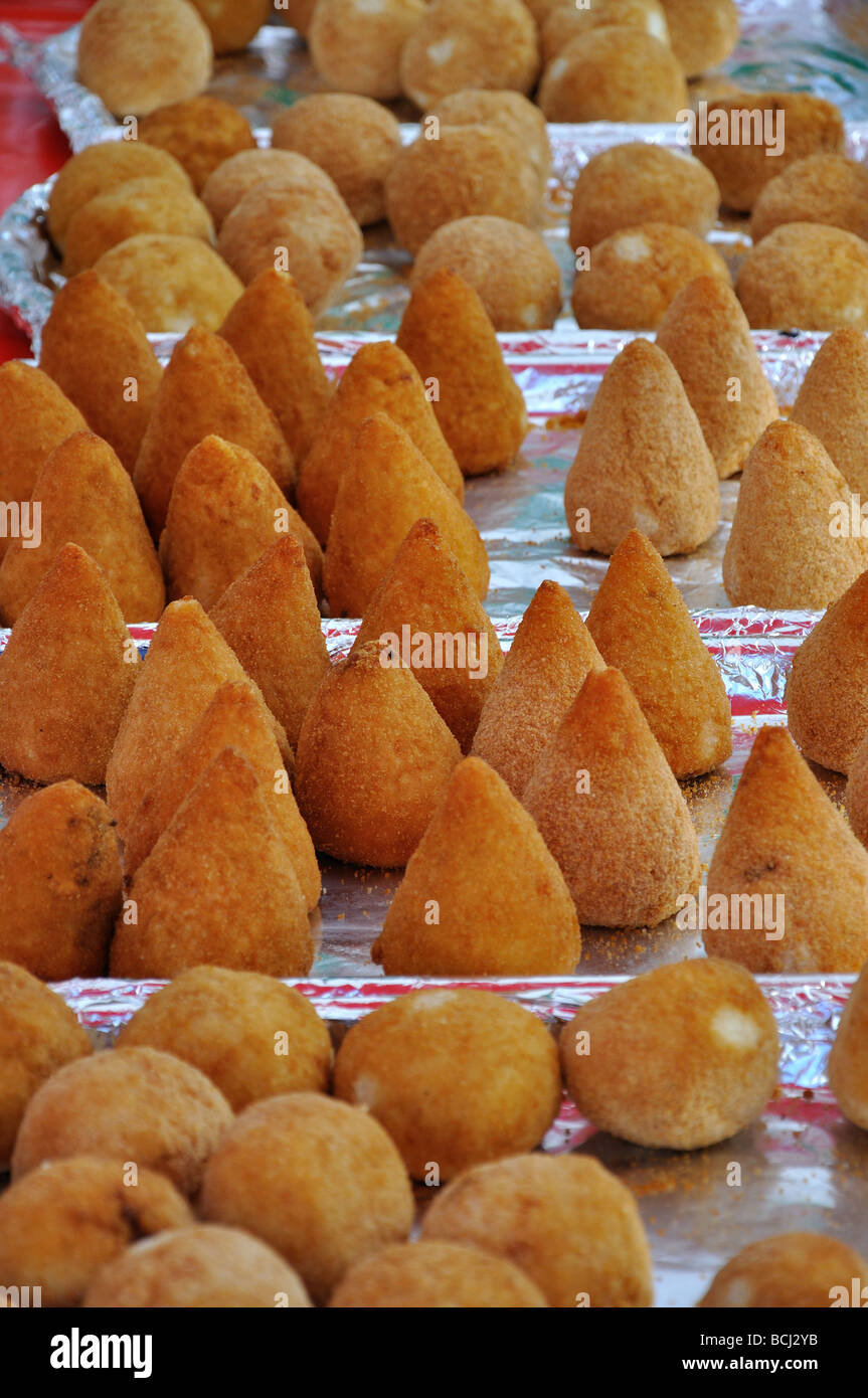 Sicilan rice balls for sale on market stall Stock Photo - Alamy