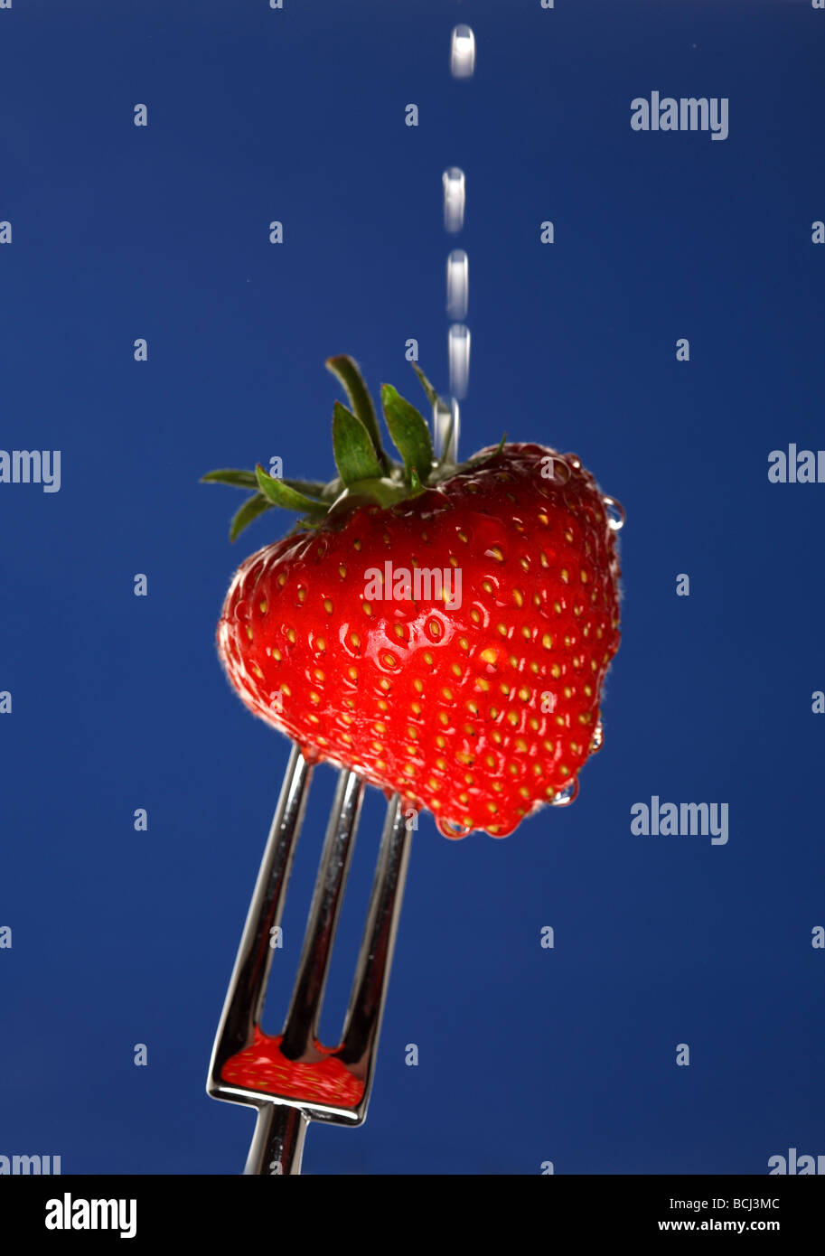 water splash on red strawberry Stock Photo - Alamy