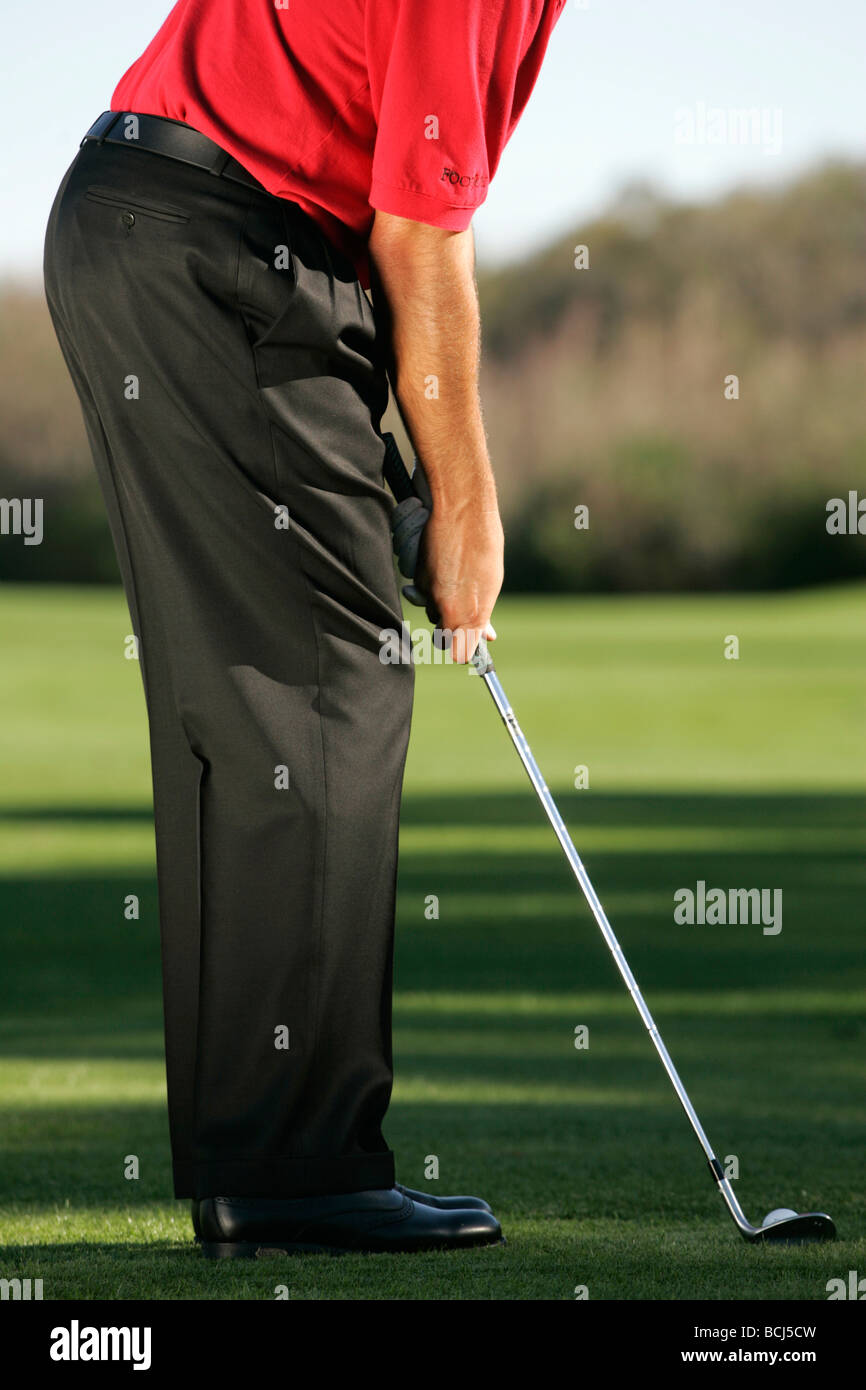 A Golfer address' the ball before playing a shot Stock Photo - Alamy