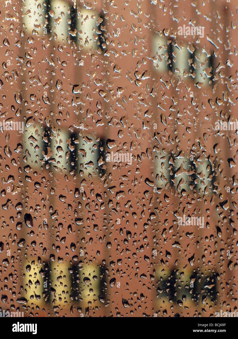 modern office block seen through rain drops covered window Stock Photo ...