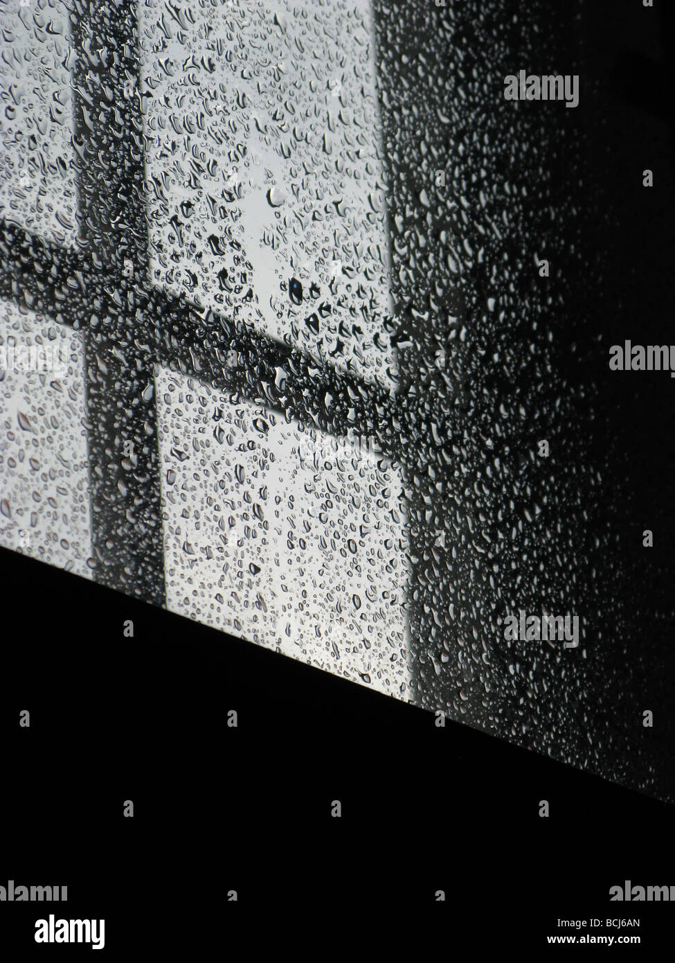 rain drops covered window seen from inside dark room Stock Photo - Alamy