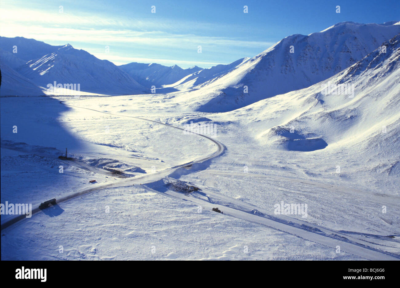 Vehicle driving Atigun Pass Brooks Range Arctic AK winter scenic ...