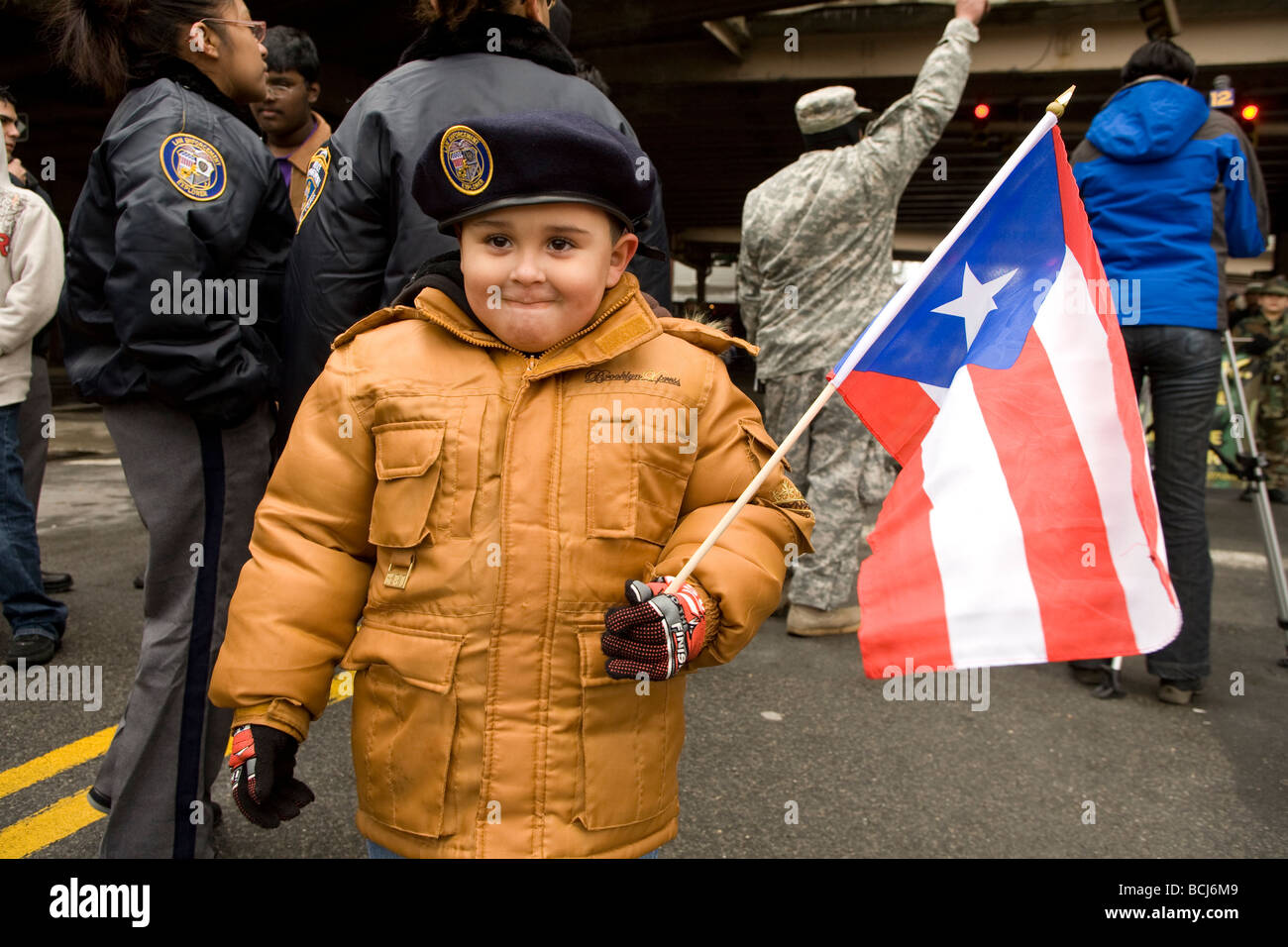 Proud children wave national flags at the Three Kings Parade in ...