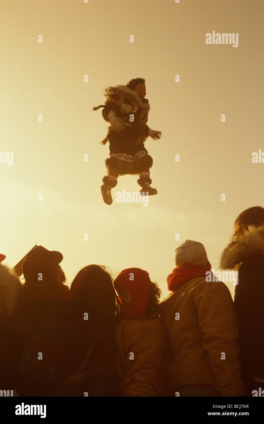 Summer silhouette of Inupiat Eskimos doing the Blanket Toss Barrow ...