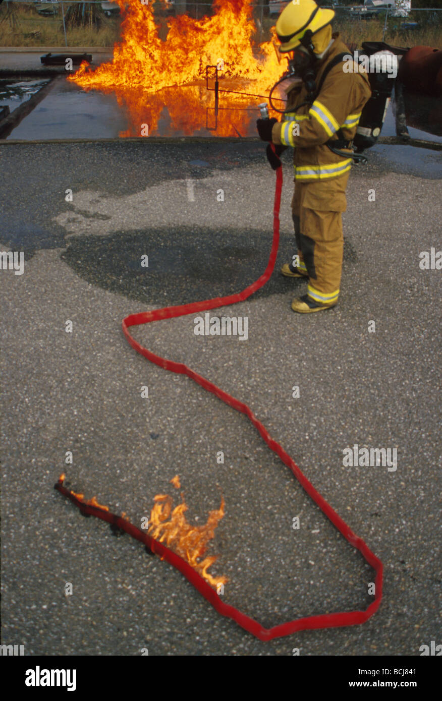 Fireman and Burning Hose Fire Training Center Juneau Stock Photo - Alamy
