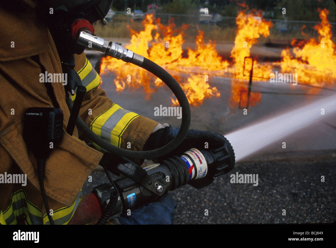 Fireman and Burning Hose Fire Training Center Juneau Stock Photo - Alamy