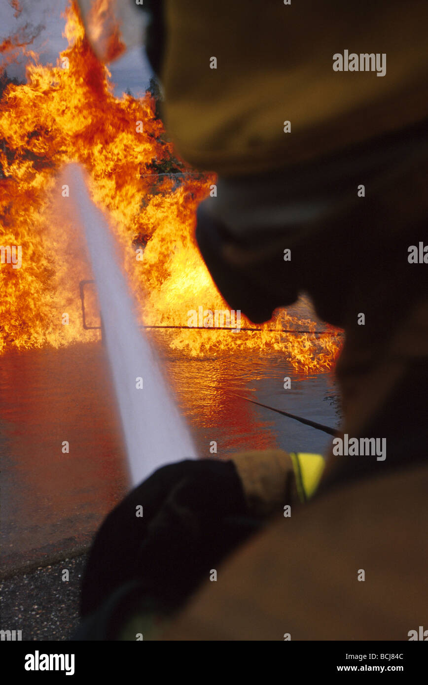 Fireman and Burning Hose Fire Training Center Juneau Stock Photo - Alamy