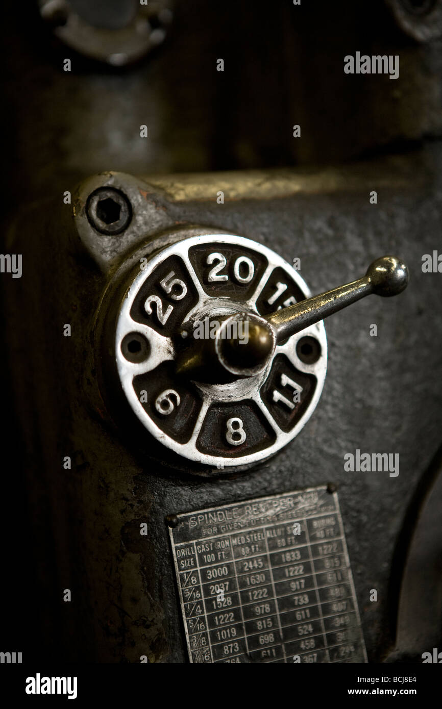 Detail of metal factory machine dial control with lever with numbers 25 ...