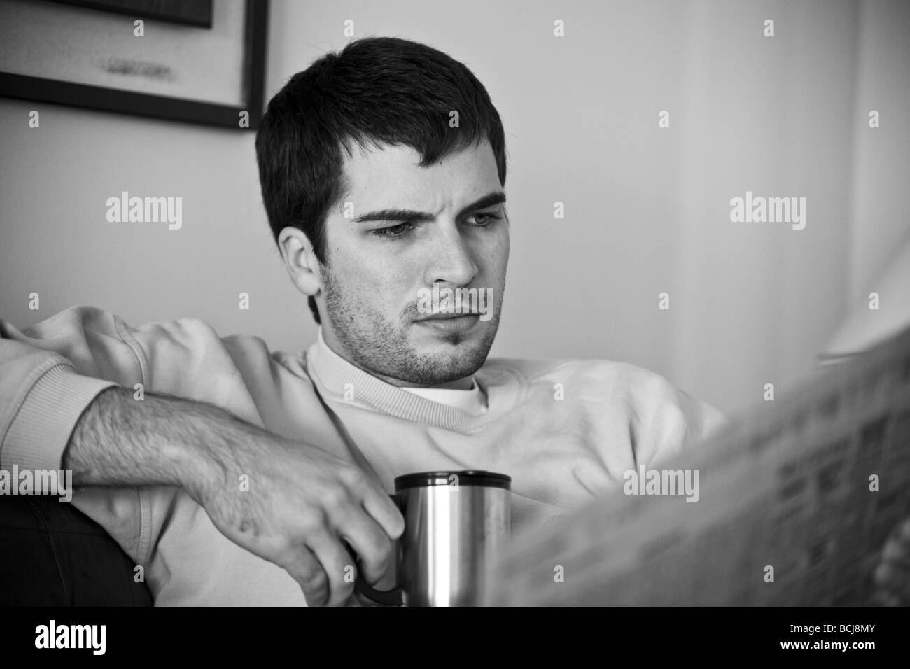 Reading the morning paper Stock Photo - Alamy