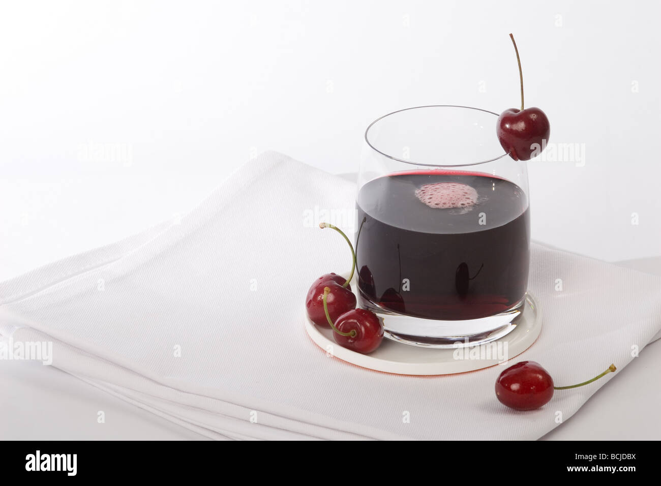 Cherry juice with foam Stock Photo - Alamy