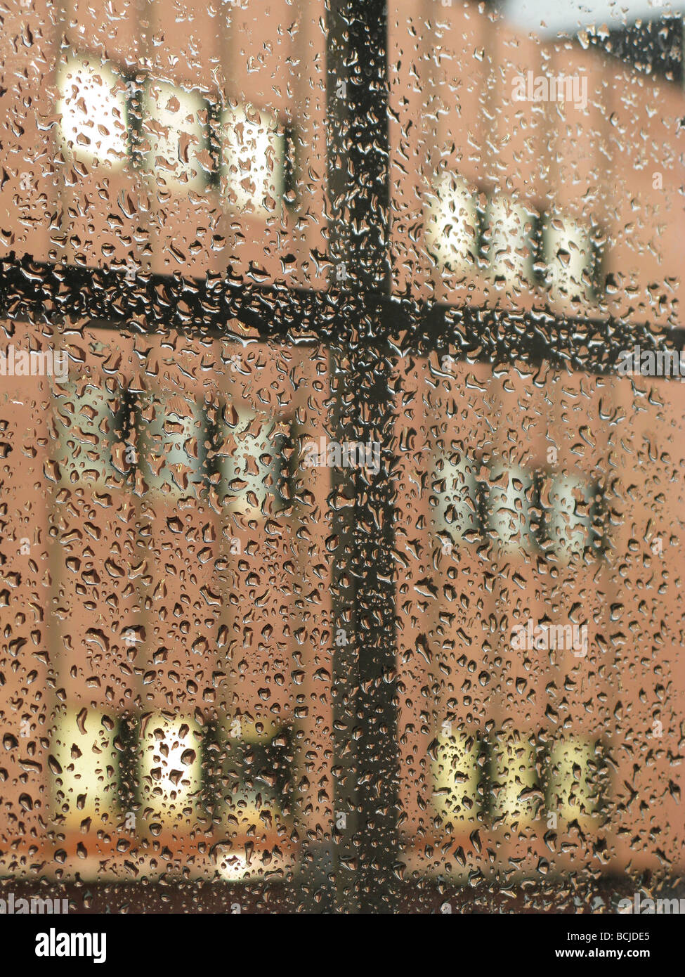 modern office block seen through rain drops covered window Stock Photo ...