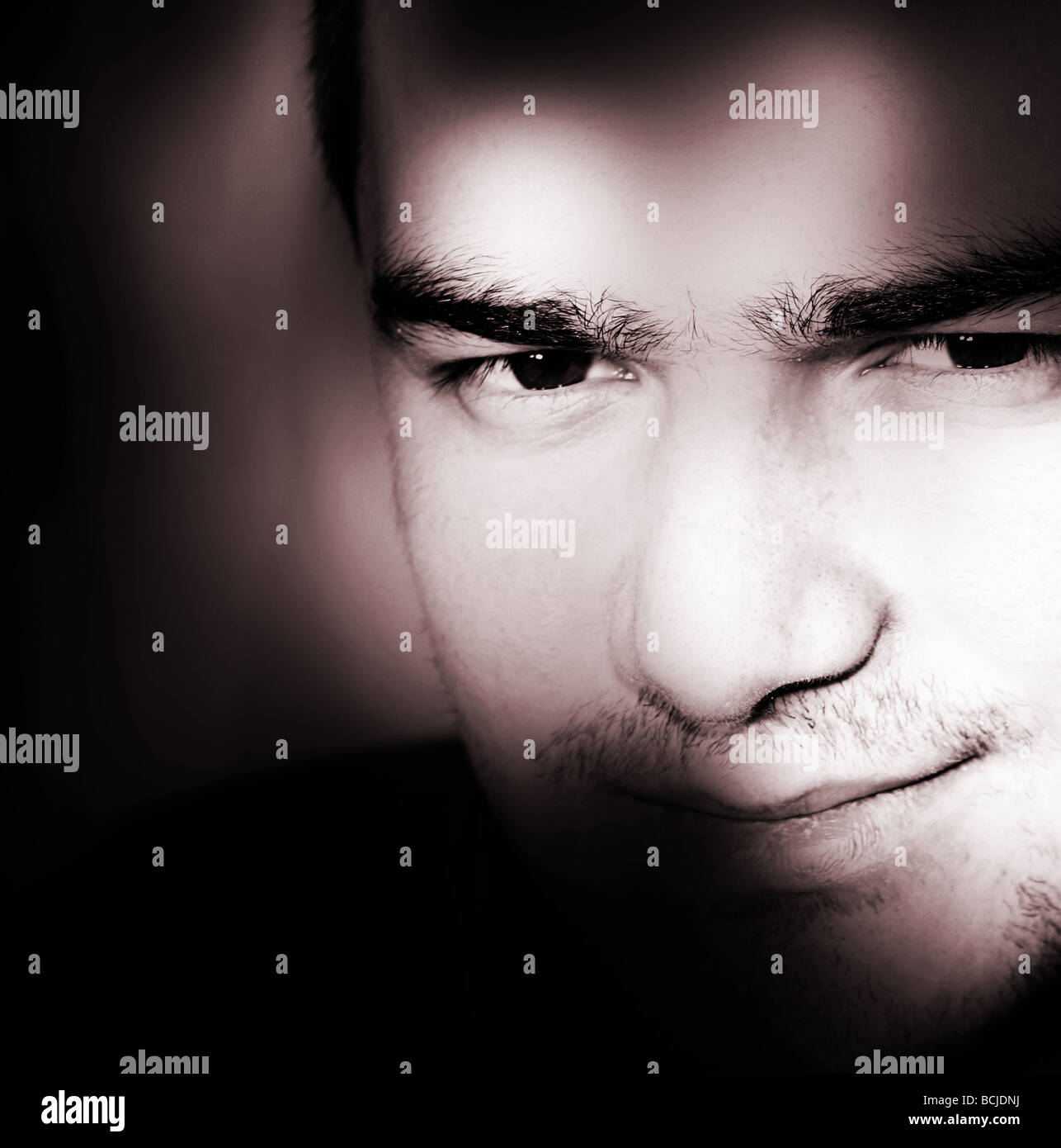 Young man - face, close-up. Looking for you ! Stock Photo - Alamy