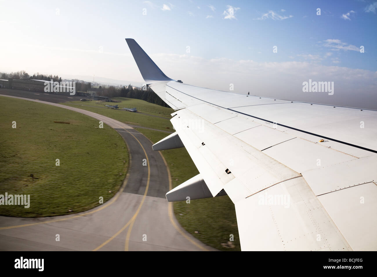 Wing from a passenger aircraft at the start Stock Photo - Alamy
