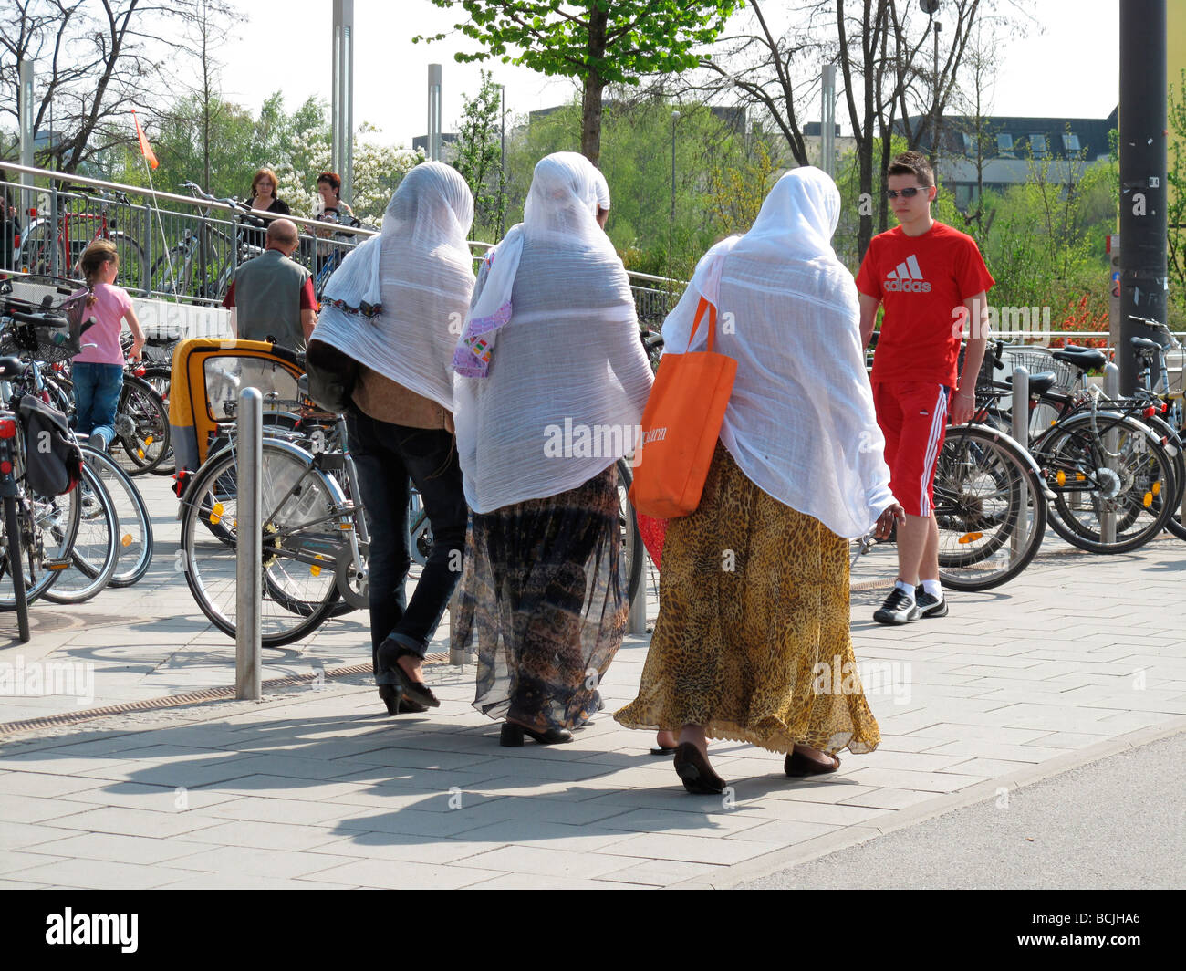 Muslim women walking in commercial shopping area Munich Bavaria Germany ...