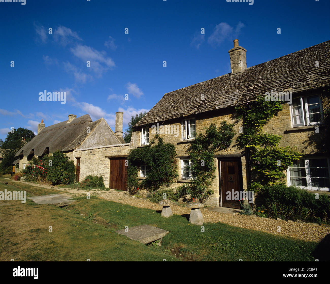 Picturesque cottages in the Cotswold village of Minster Lovell on the ...