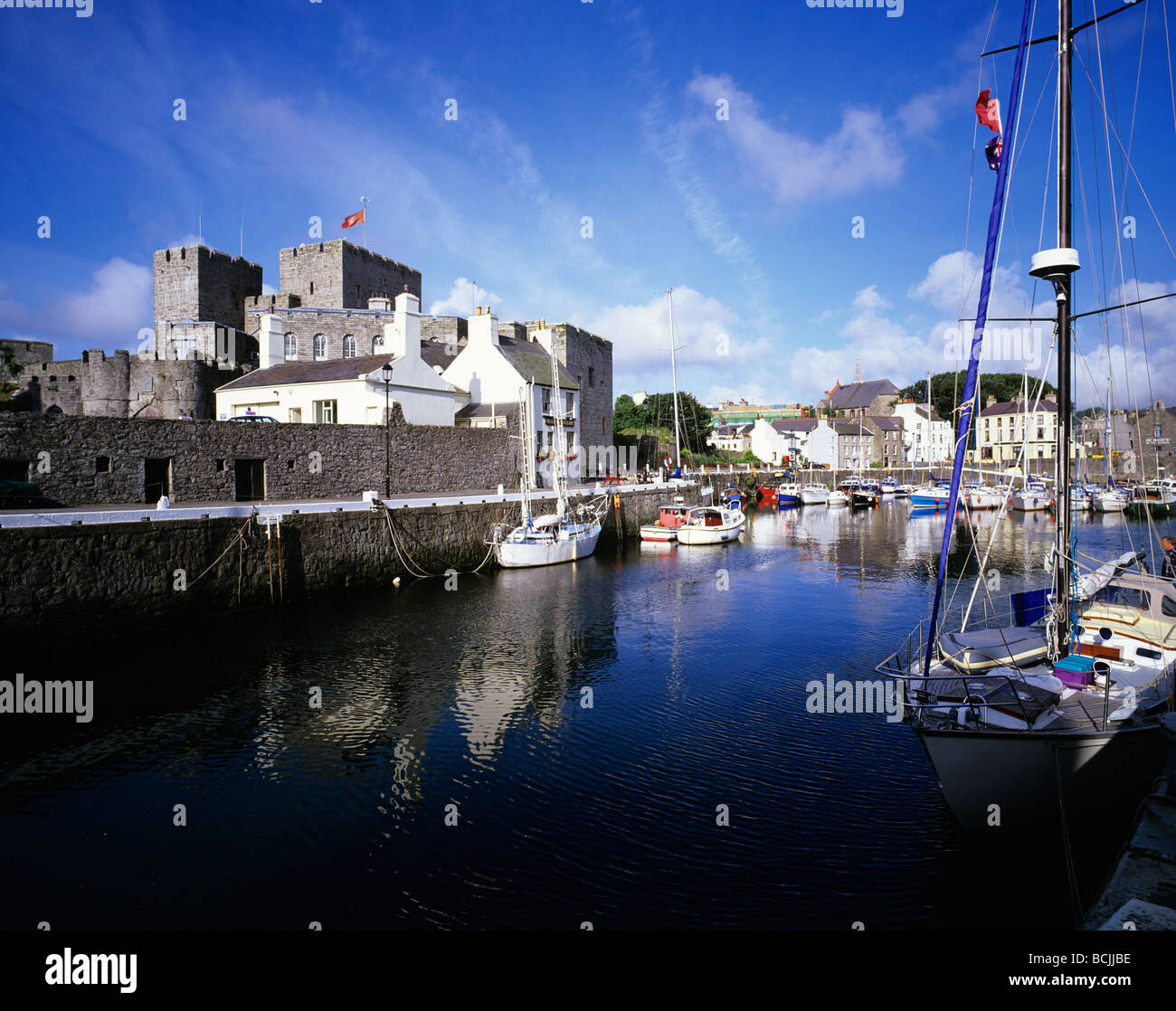 Harbour scene showing Castle Rushen in Castletown the island's former ...