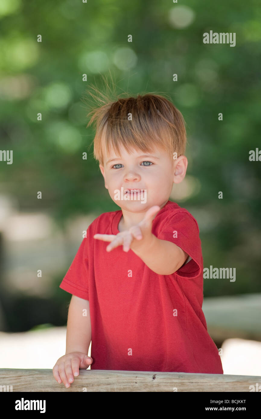 Baby boy holding out hand people hi-res stock photography and images ...