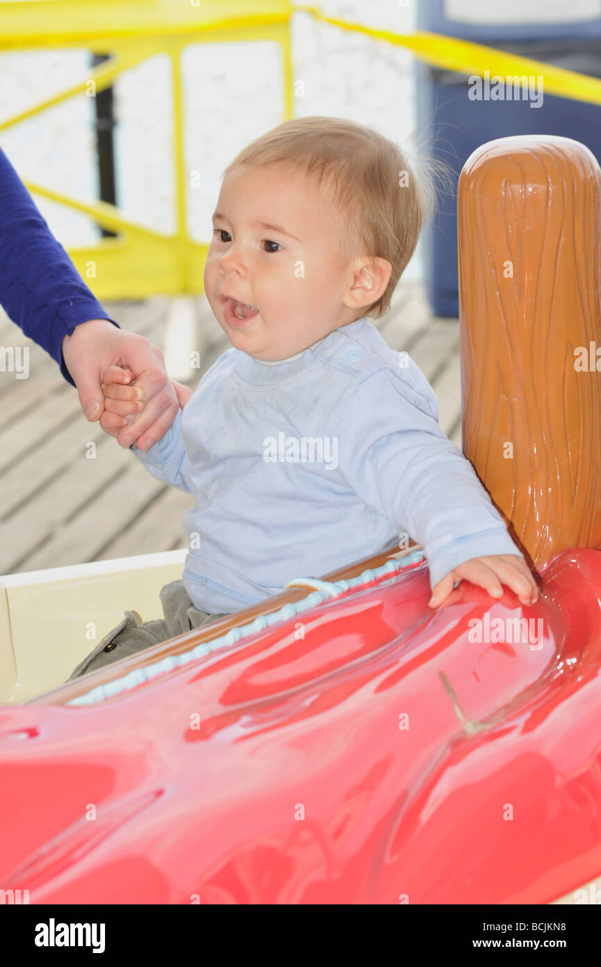 baby on fairground ride Stock Photo - Alamy