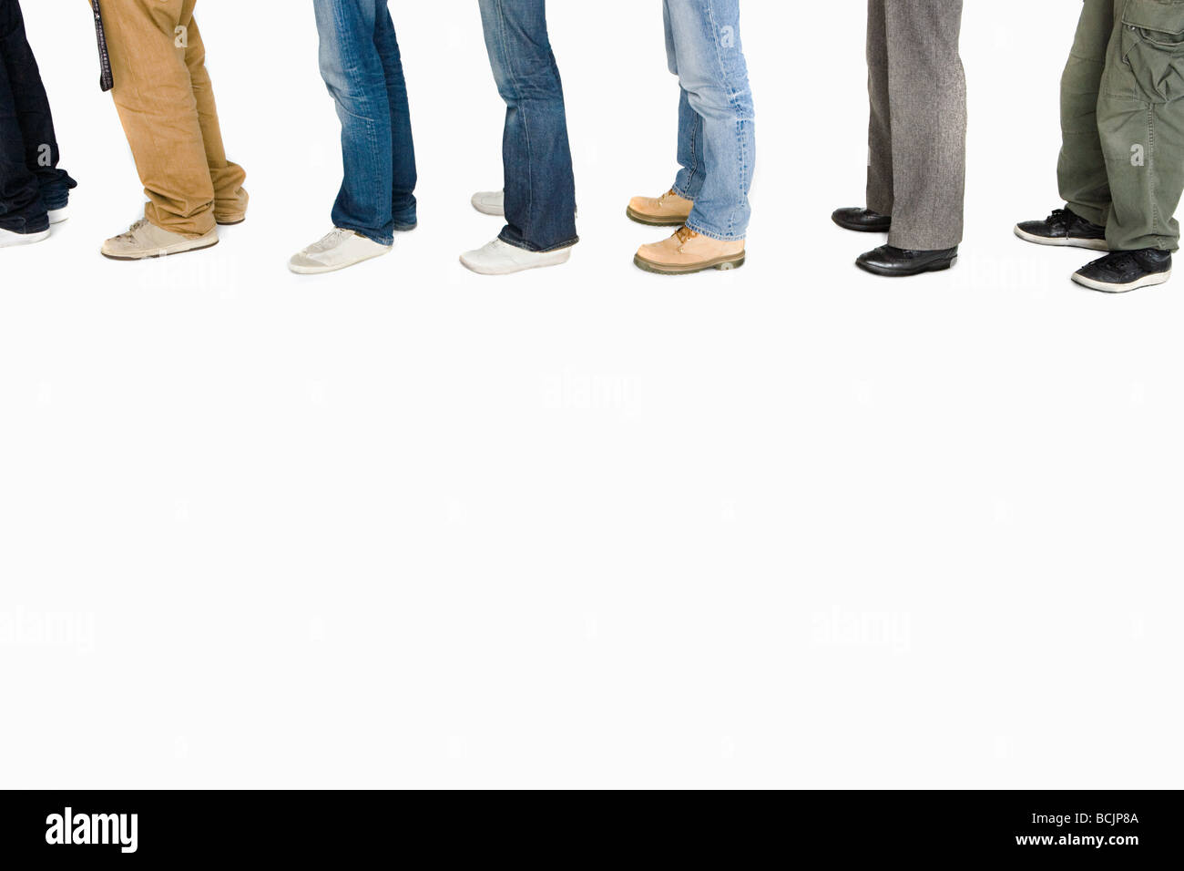 Legs of people in a row Stock Photo - Alamy