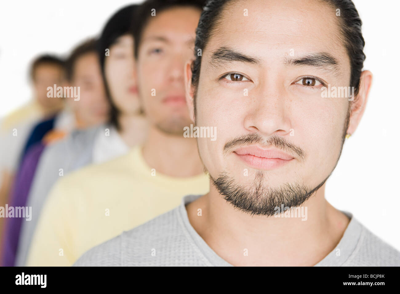 Man in a row Stock Photo - Alamy