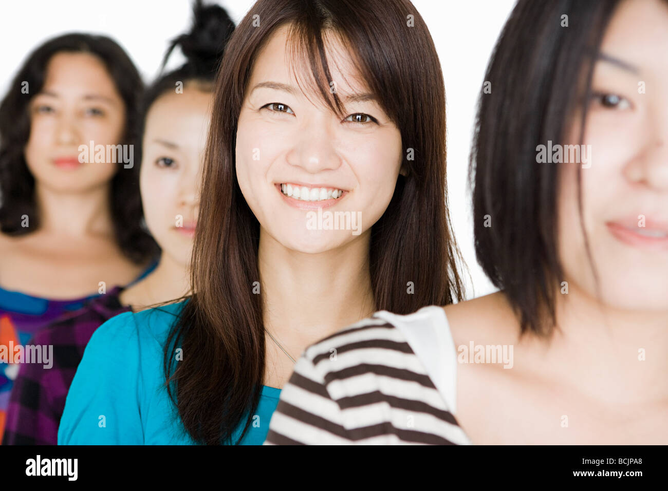 Women in a row Stock Photo - Alamy