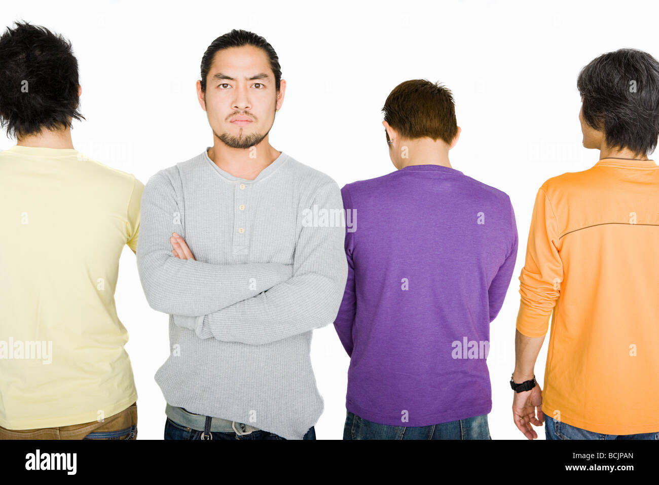 Angry man in row of people Stock Photo - Alamy