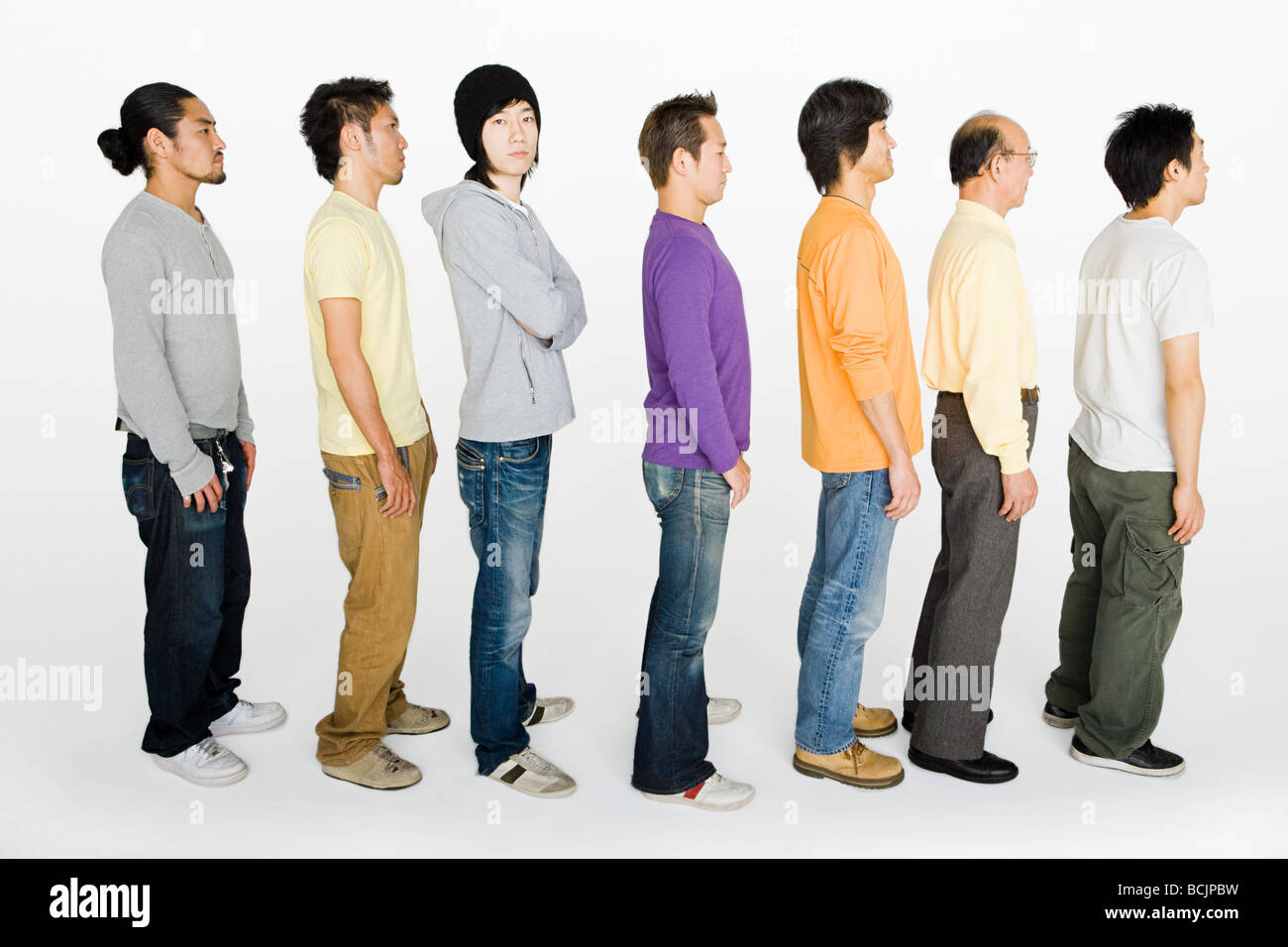 Men in a row Stock Photo - Alamy