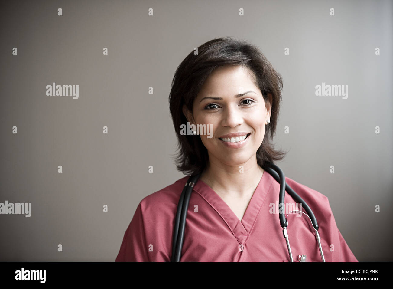 Hispanic female doctor headshot hi-res stock photography and images - Alamy