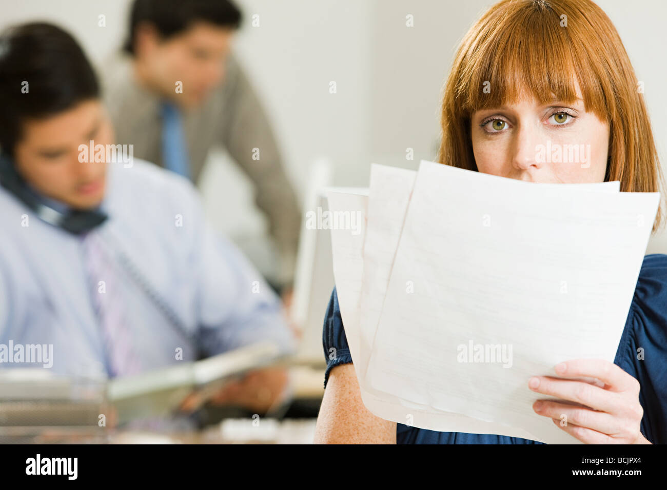 Ginger haired female office worker Stock Photo - Alamy