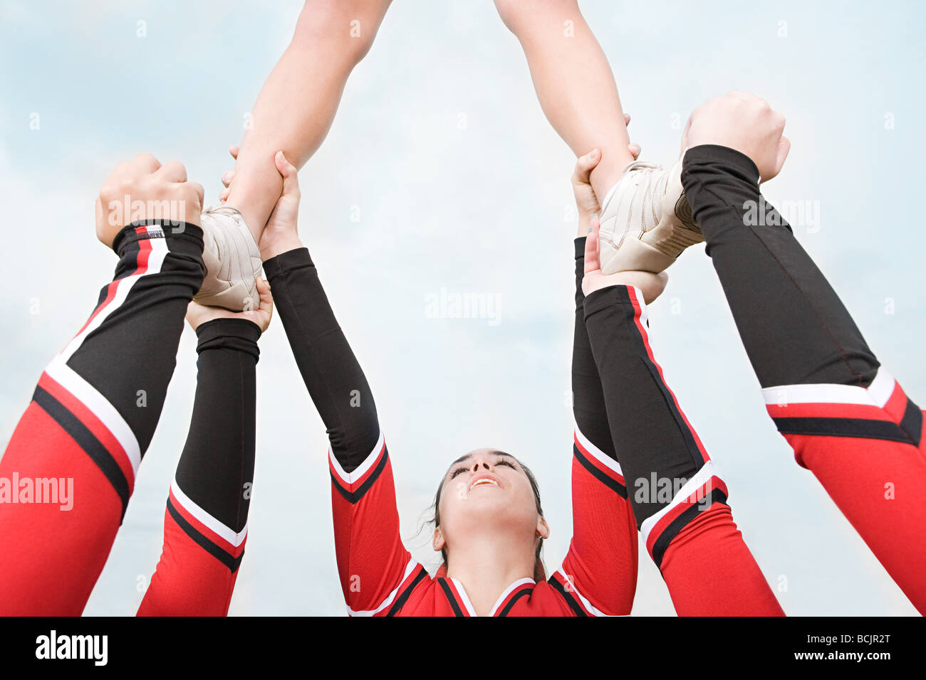 Cheerleaders performing routine Stock Photo - Alamy