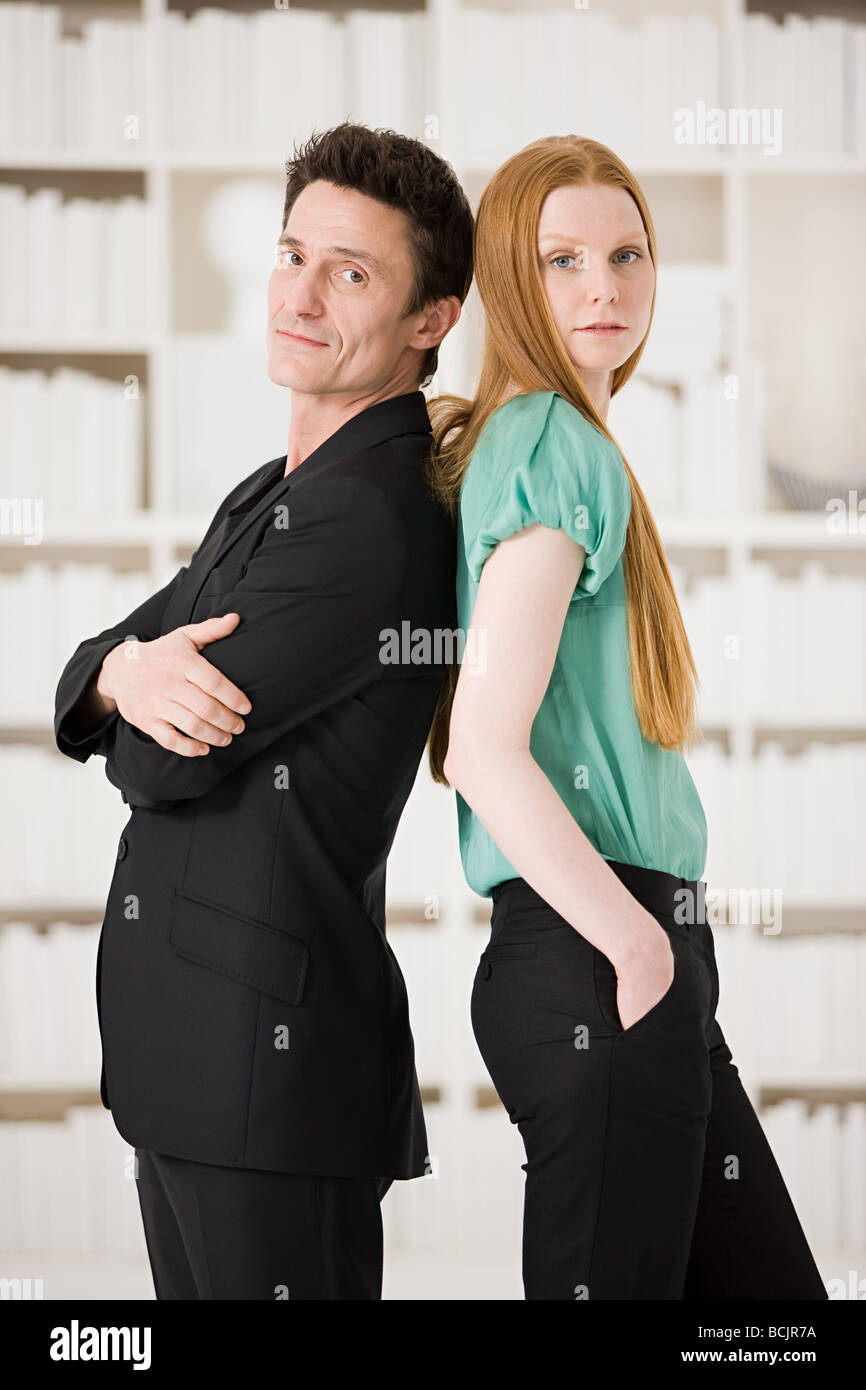Man and woman back to back Stock Photo - Alamy