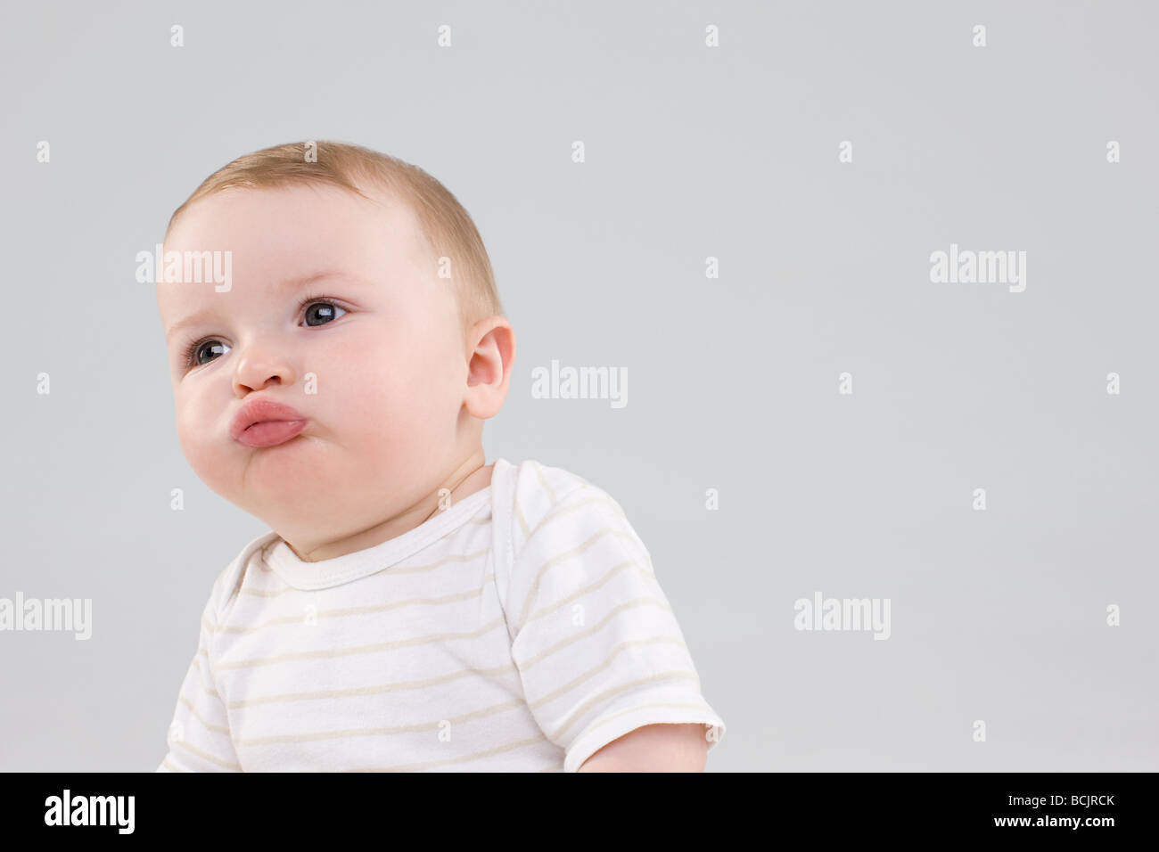 Baby making faces Stock Photo - Alamy