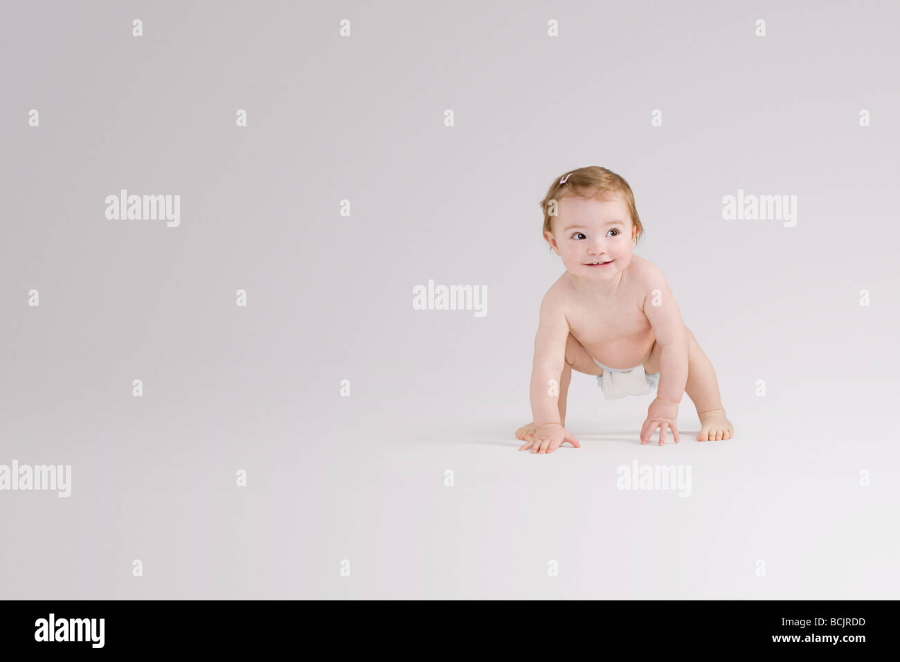 Baby girl diaper crawling hi-res stock photography and images - Alamy