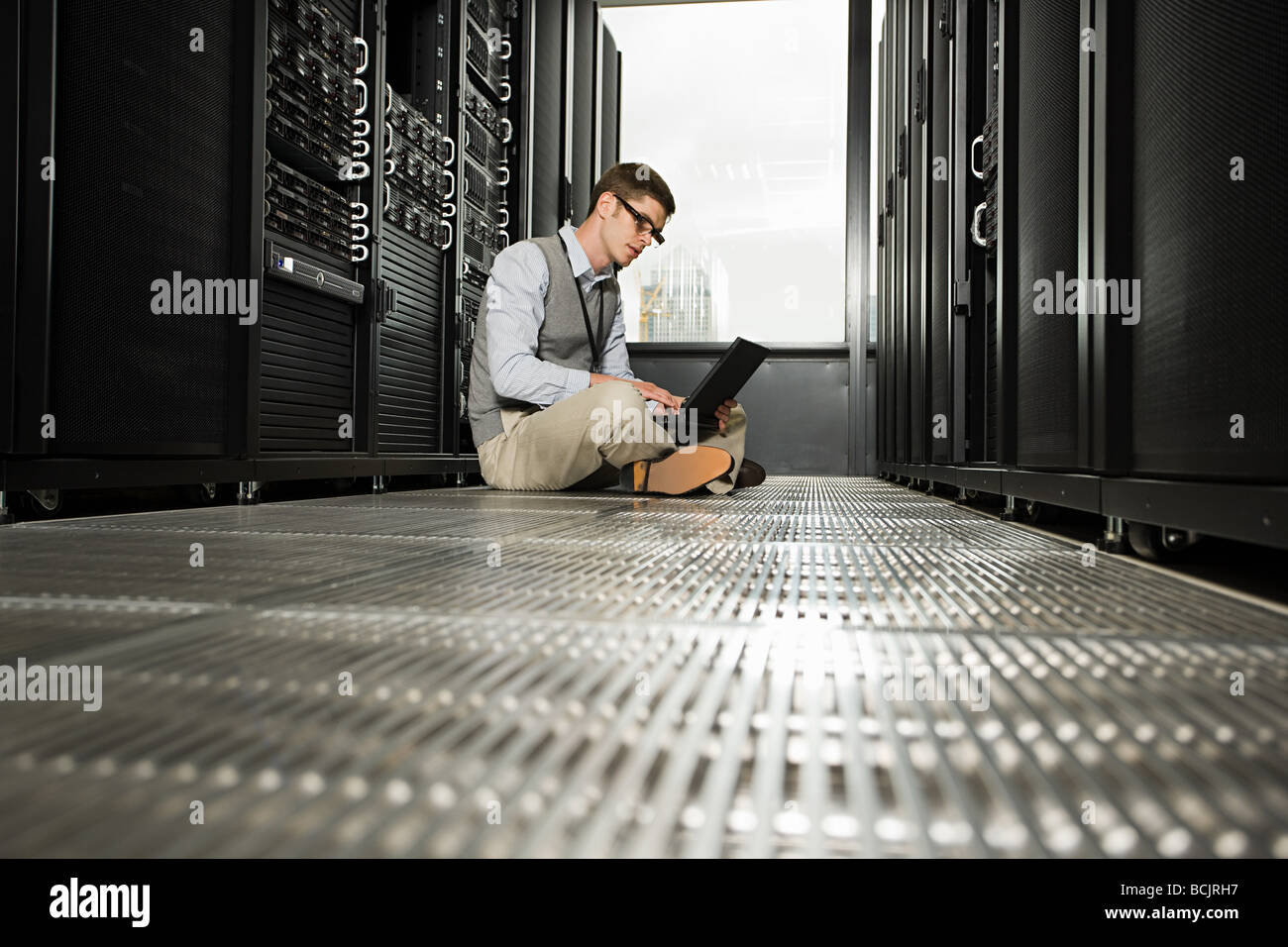 Male computer technician working Stock Photo - Alamy