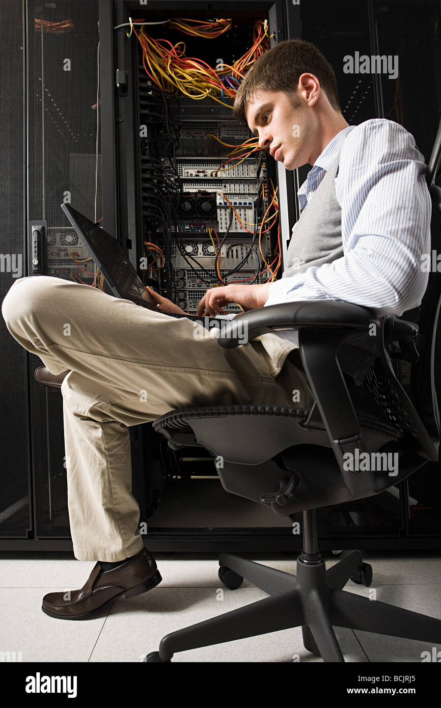 Male computer technician working Stock Photo - Alamy